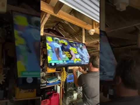 I was out of wall space in my shop so I made a flip down bracket for a TV.
