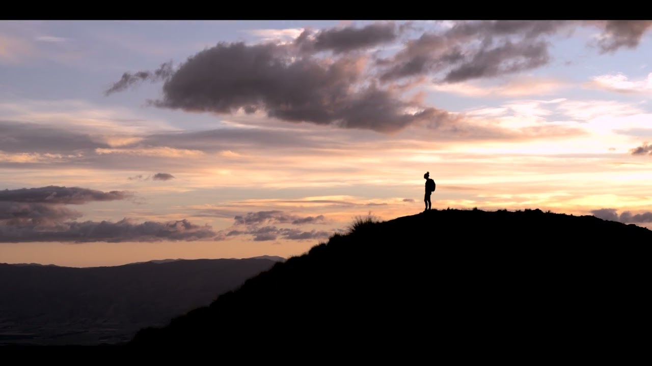 Silhouette of Woman on a mountain, Hiking, Sunrise, Nature | Aerial Drone Stock Video Footage | Free