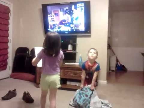 Kids learning the basics of make believe