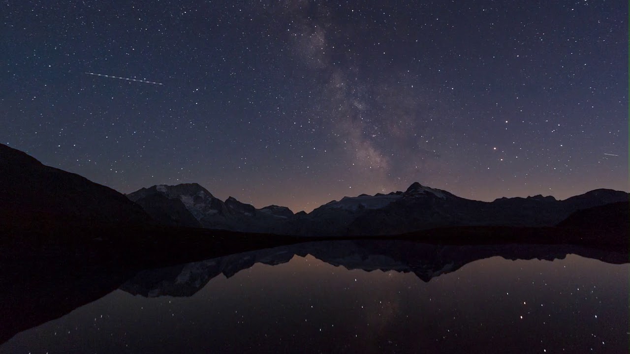 Beautiful Timelapse of the Night Sky with Reflections in a Lake-free stock footage