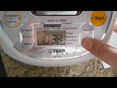 Trying to Change time on my Tiger JBV-S10U Rice cooker. Plug power. Press hold hour/min. Menu done