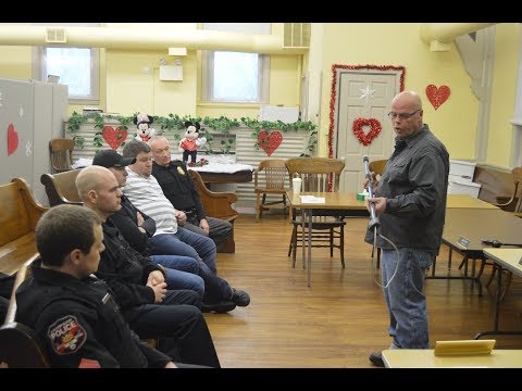 Shelter manager training cops on handling dogs