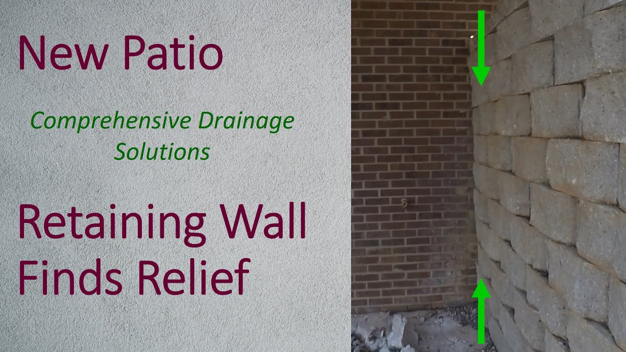 Drainage system stabilizes retaining wall