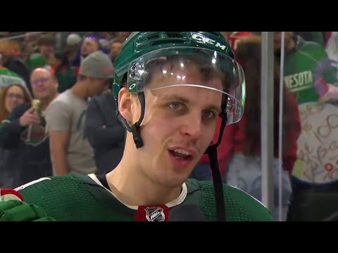 Joel Eriksson Ek chats with Kevin Gorg following his game-winning overtime goal