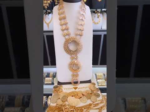 long gold necklace design with round pendant