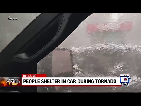 People shelter in car during tornado
