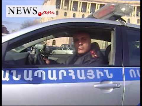 Armenian policeman smokes whiles driving