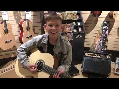 Shopping for a guitar at the Sam Ash music store in New York City