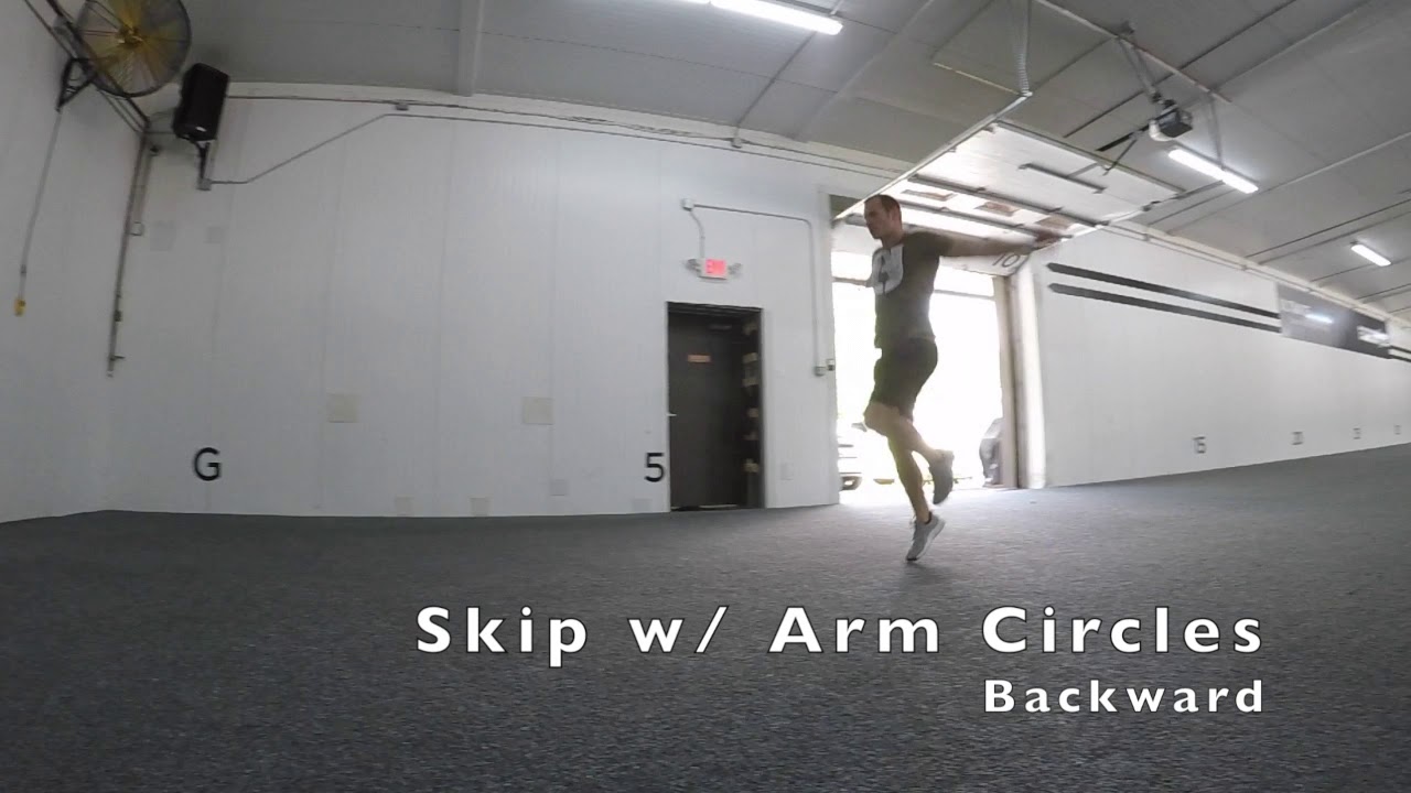 Skip w/ Arm Circles - Backward