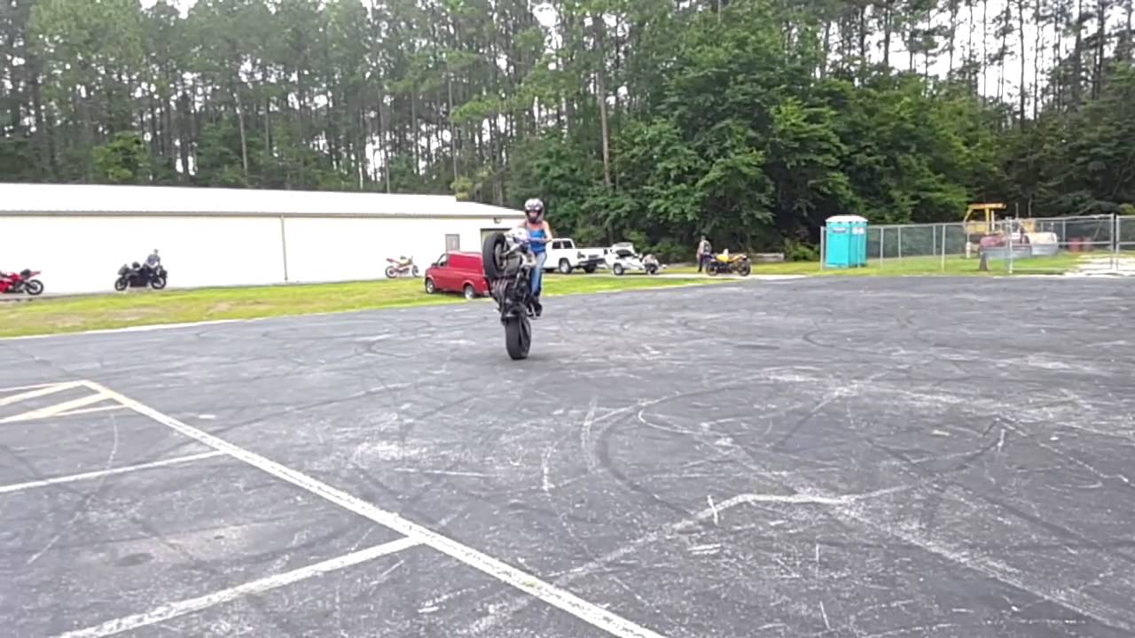 Girls doing tandem wheelies