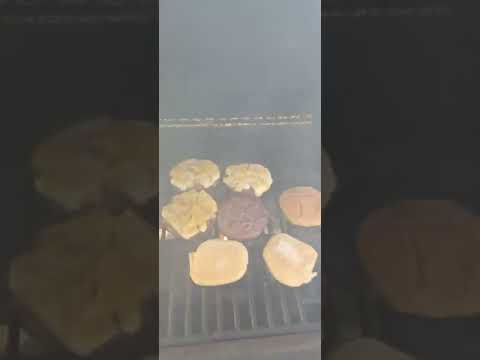 Char-grilled BBQ Black Angus burgers w/ garden fresh 🍅 and pickles
