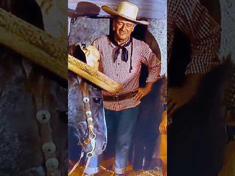 JOHN WAYNE BUYS MOSE A DRINK.