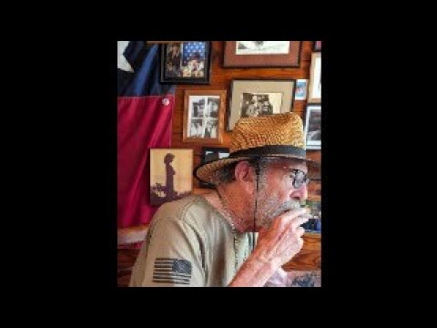 Rev. Sean reads poetry on his porch, in memory of Kinky Friedman...