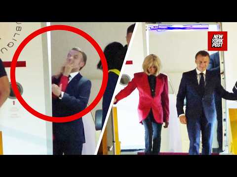 Insane moment Macron is smacked in the face by his wife as they arrive in Vietnam