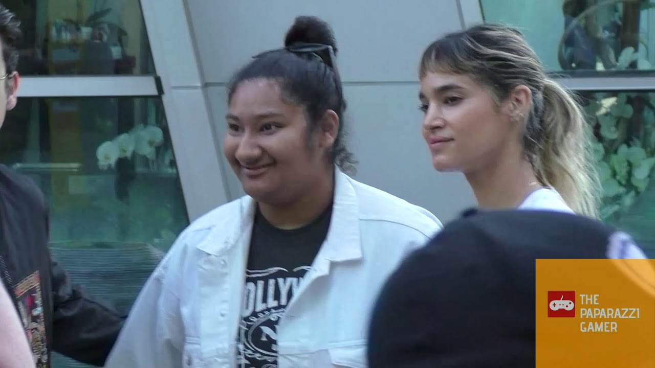 Sofia Boutella and Keean Johnson greet fans outside the premiere of Apocalypse Now Final Cut