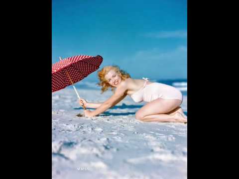 Colour photos of Marilyn Monroe and the umbrella on Tobay beach NY 1949 By Andre de Dienes