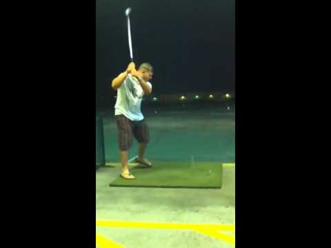 pro golfer hits the movie theater behind net