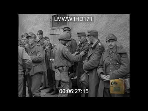 BATTLE FOR CHERBOURG 6/26/44, US TROOPS MARCHING THROUGH MONTEBOURG, 6/19/44 - LMWWIIHD171