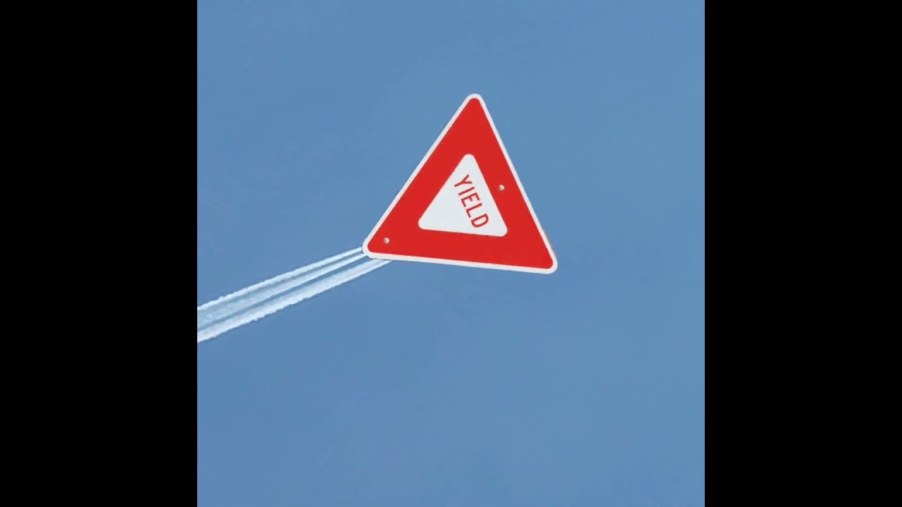 Yield Sign Producing A Contrail