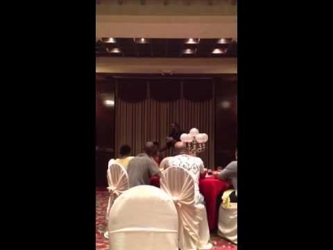 Robert Hatcher singing to LeAndria Johnson and baby Caelington