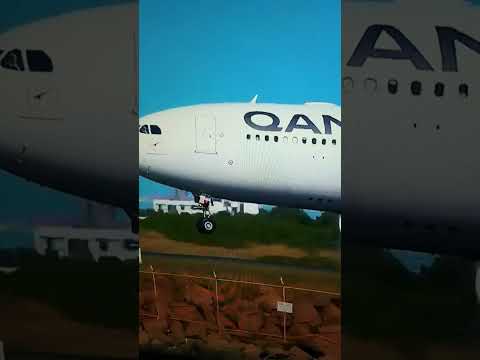 QANTAS AIRLINES IS TAKING OFF AT THE SYDNEY AIRPORT.