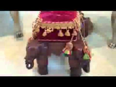 4 Elephants with trunks up for Good Luck on Foot stool..wmv