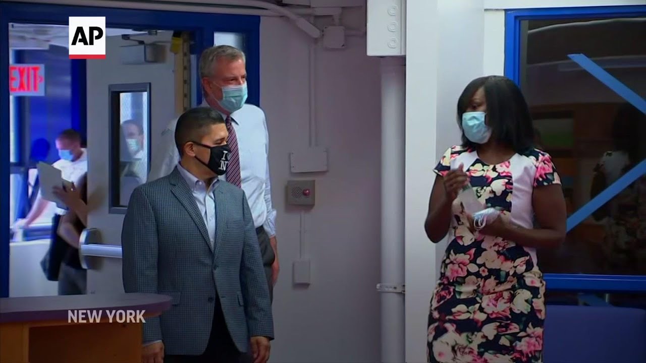 NYC mayor defends school reopening timetable
