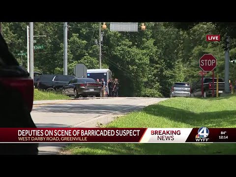 Standoff underway along Greenville County roadway; suspect barricaded in car, deputies say