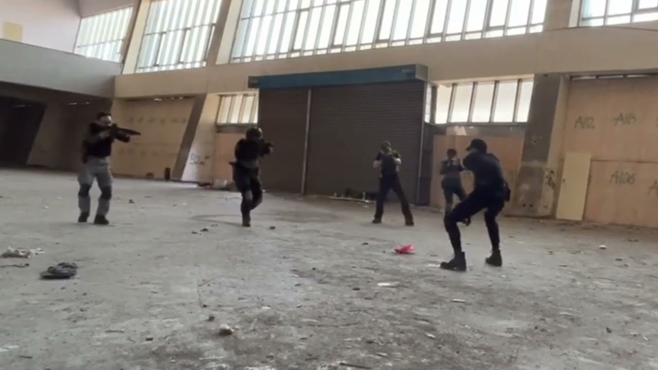 The team's tactical formation and practice of CQB entering the house