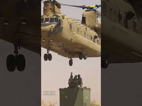 CH-47 Chinook carries containers of US Army supplies
