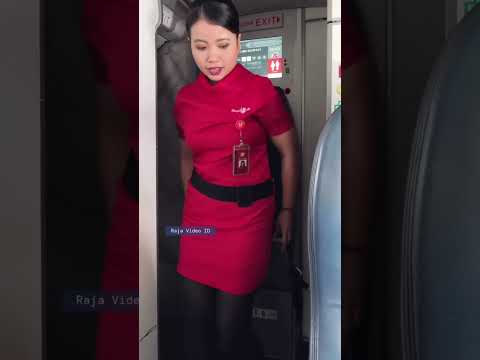 Beautiful Wings Air Flight Attendants Sitting and Wearing Seat Belts in an ATR 72-600 Aircraft.