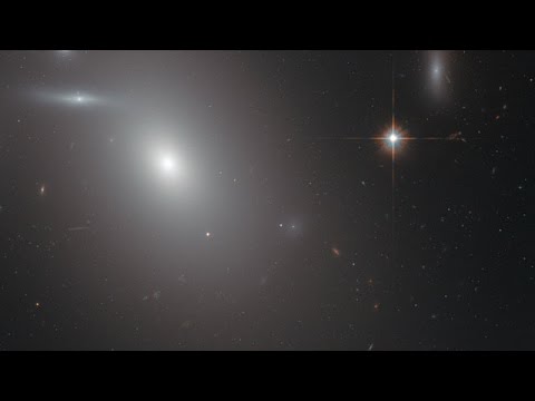 Panning across the elliptical galaxy NGC 4889