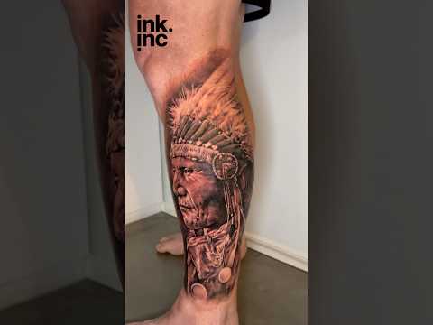 Realistic Native American Portrait Tattoo with Detailed Headdress on Calf