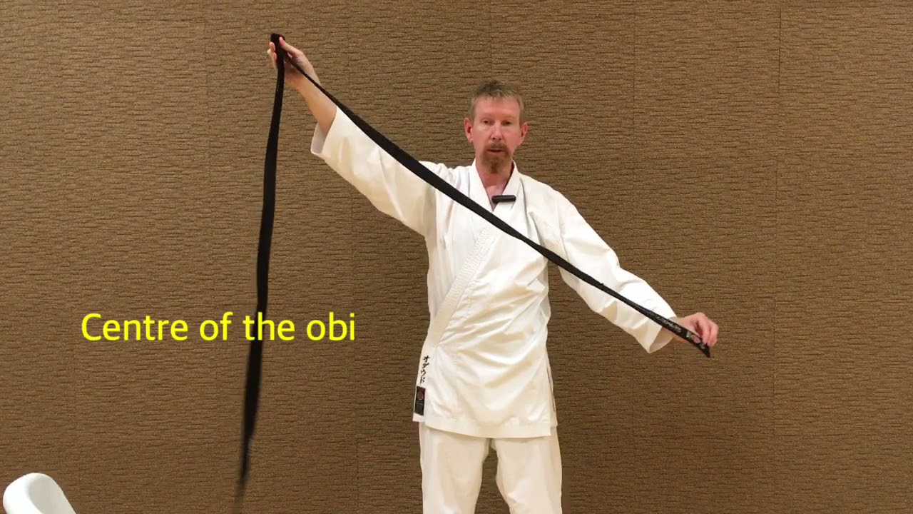 Putting on karate-gi & obi