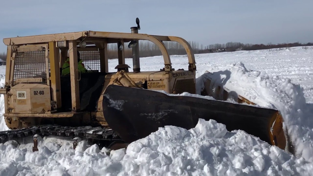 Cat D7 V-plow ditches