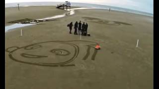 Artistic robot draws enormous sand doodles on a beach - The Mirror