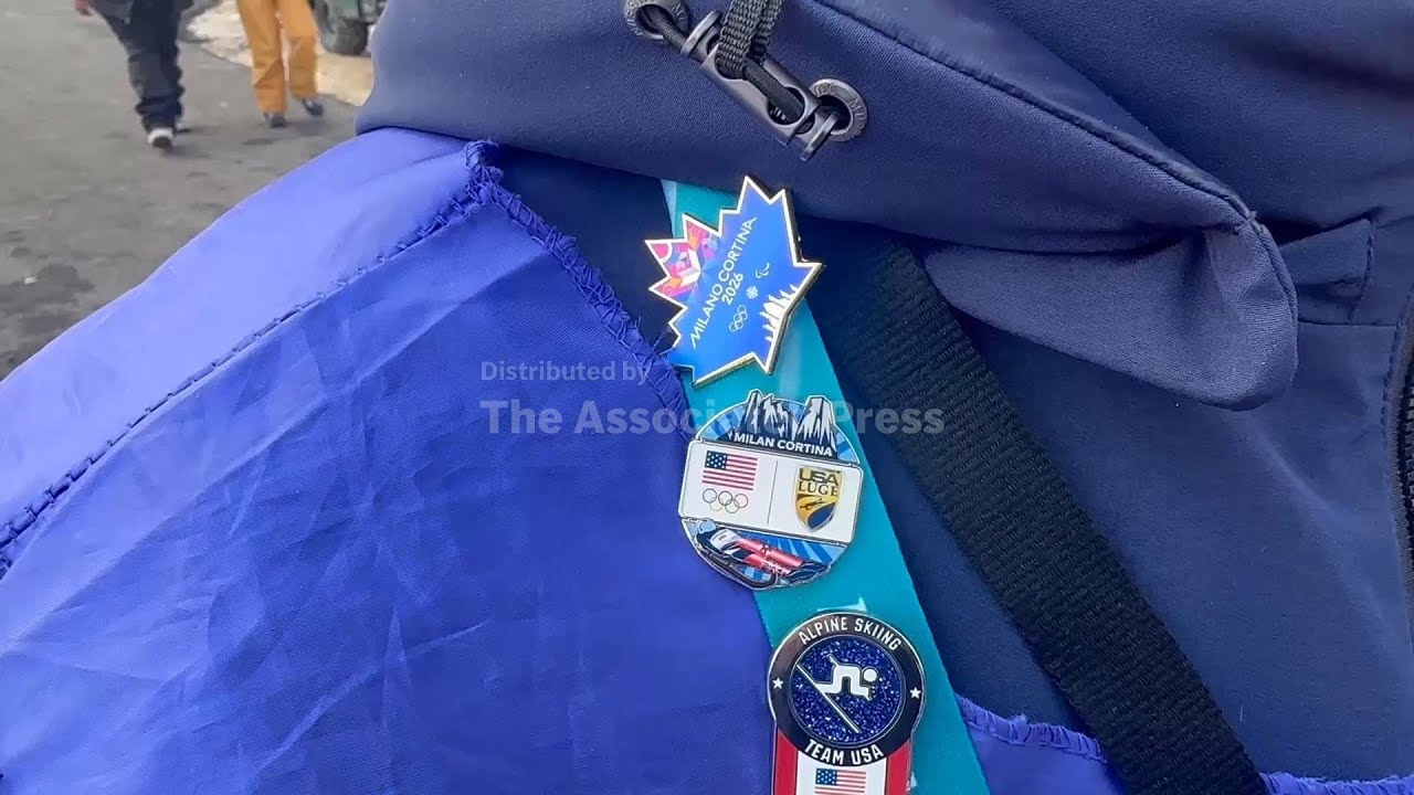 Pin trading thrives in Cortina during Italy's Winter Olympic Games, AP explains