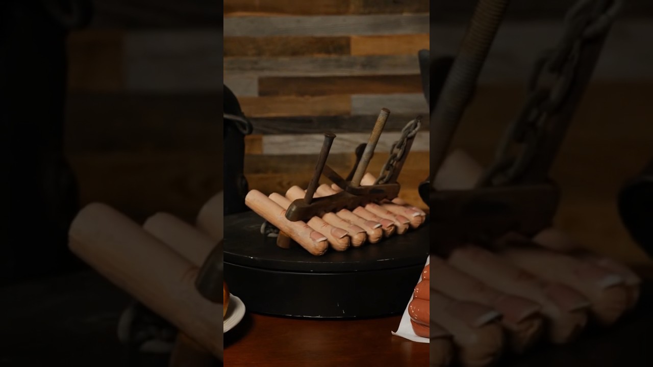 Our hand-crushing torture devices in action as they take on hotdogs disguised as fingers. #shorts 🌭