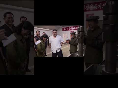 The Great Leader Kim Jong Un inspects the factory and warmly greets the comrade workers.