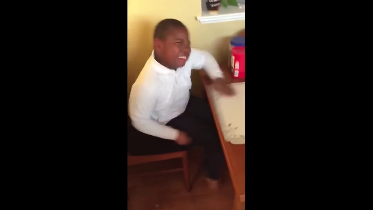 Black kid raging at table