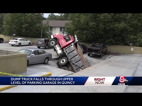 Dump truck falls through upper level of Quincy parking garage