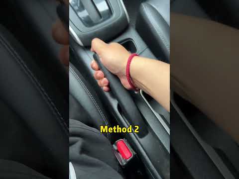 In an automatic car, it doesn't matter whether you engage the gear or release the handbrake first.