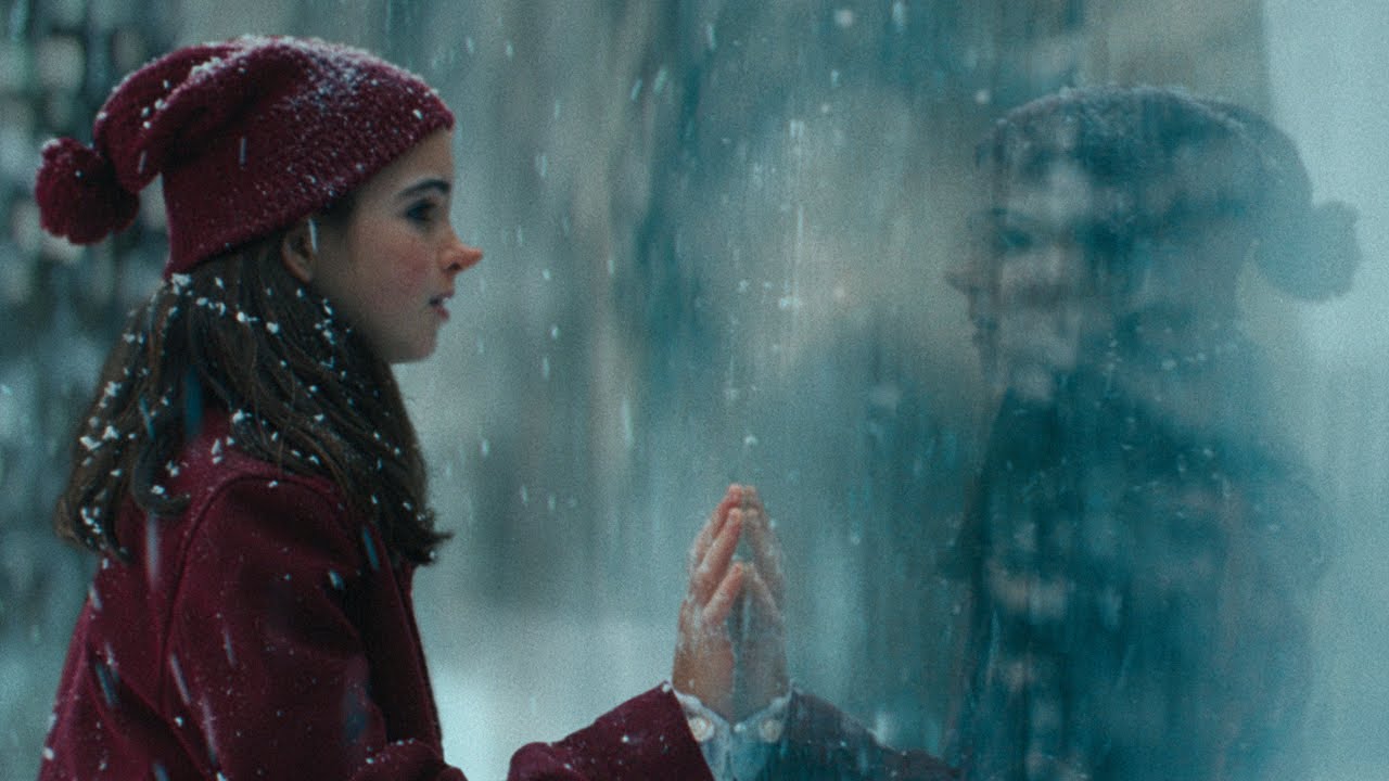 German holiday ad depicting two girls separated by invisible barriers ...