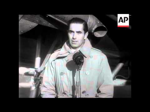 TYRONE POWER PILOTS OWN PLANE ON WORLD TRIP