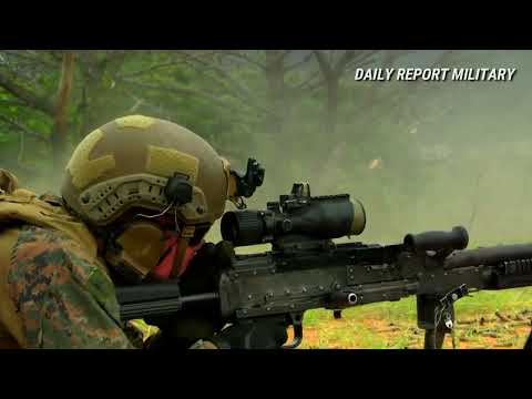 U.S. Marines fire M240B machine guns during a live-fire range exercise