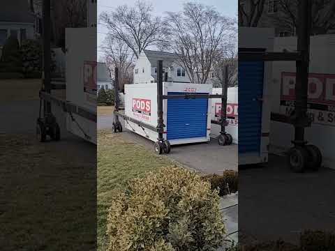Pods Containers. Picking up loaded with furniture. Dropping off empty one.