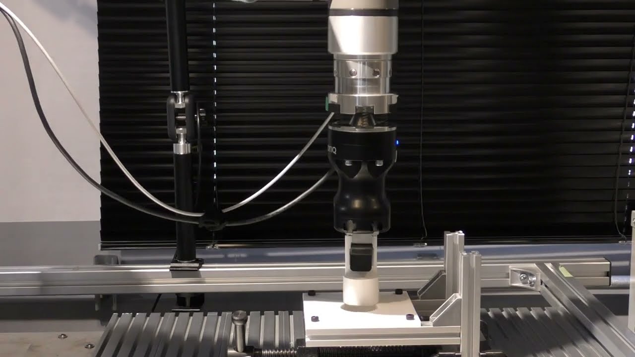 Robotic Object Insertion with a Soft Wristthrough Sim-to-Real Privileged Training