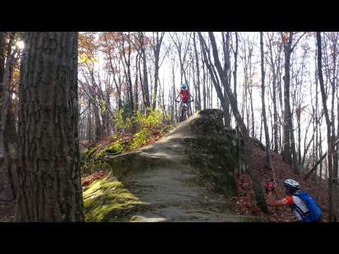 Local rider, Syd Schulz, descends Finger Rock as her boyfriend, Macky ...