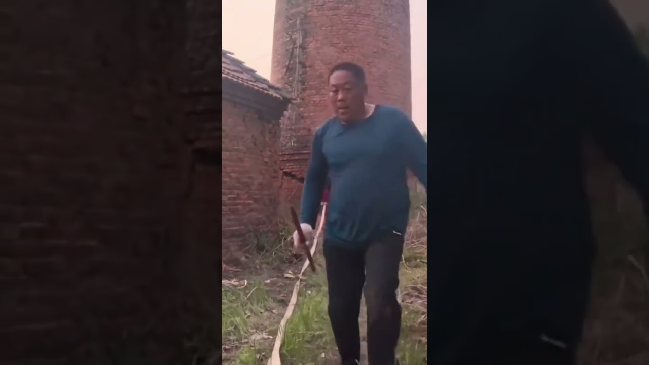 demolishing a building like a tall tower made of brick because it no longer looks sturdy