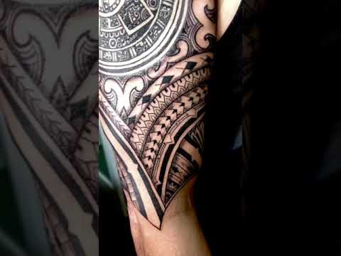 Tribal tattoo with Mexican Aztec calendar.